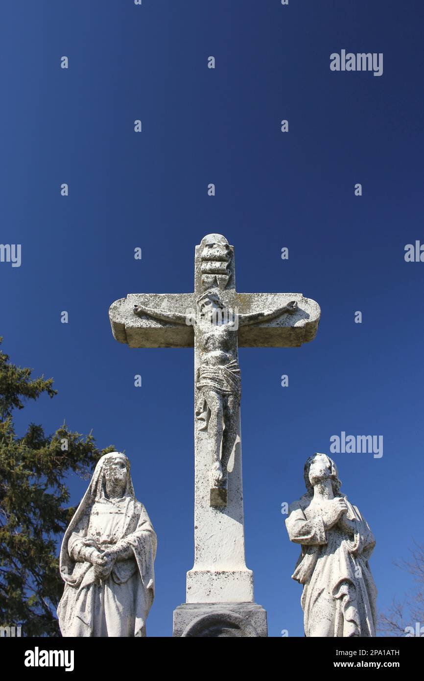 Jesus Christ hanging on the cross with his mother Mary standing by ...