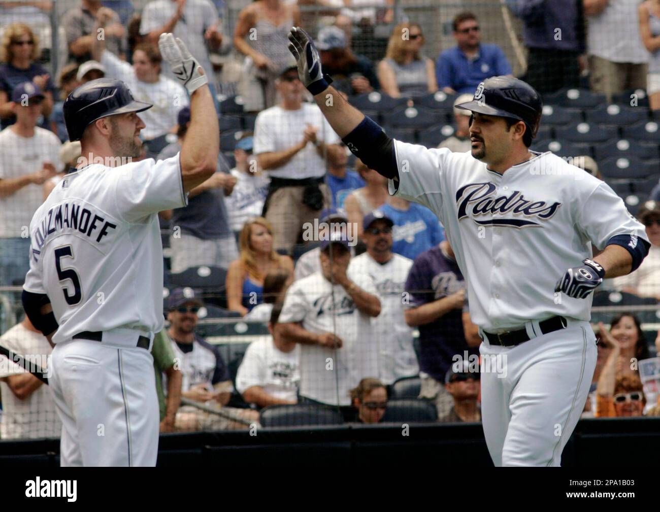 San Diego Padres' Edgar Gonzalez, right, is congratulated by teammate ...