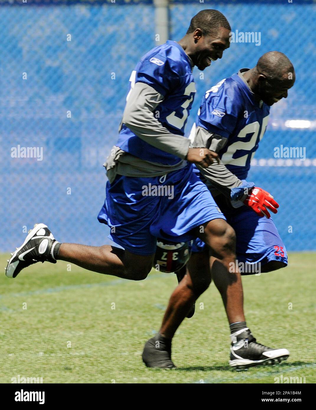 New York Giants safety James Butler, left, races cornerback R.W ...