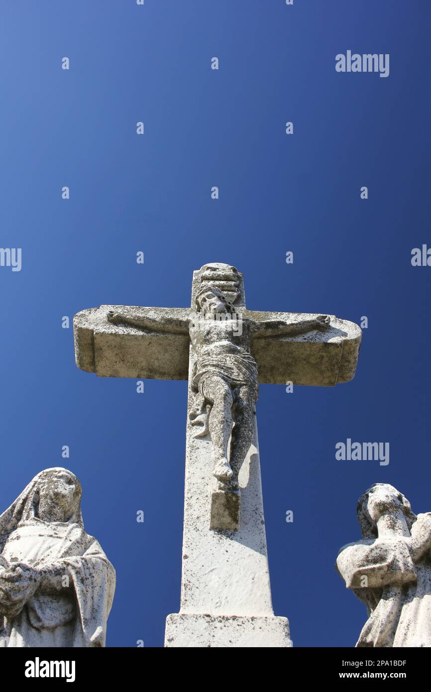 Jesus Christ hanging on the cross with his mother Mary standing by ...