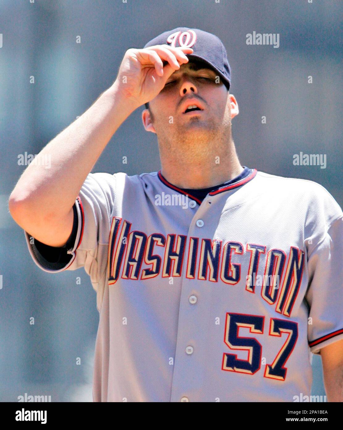 Washington Nationals pitcher Jason Bergmann reacts to serving up a two ...