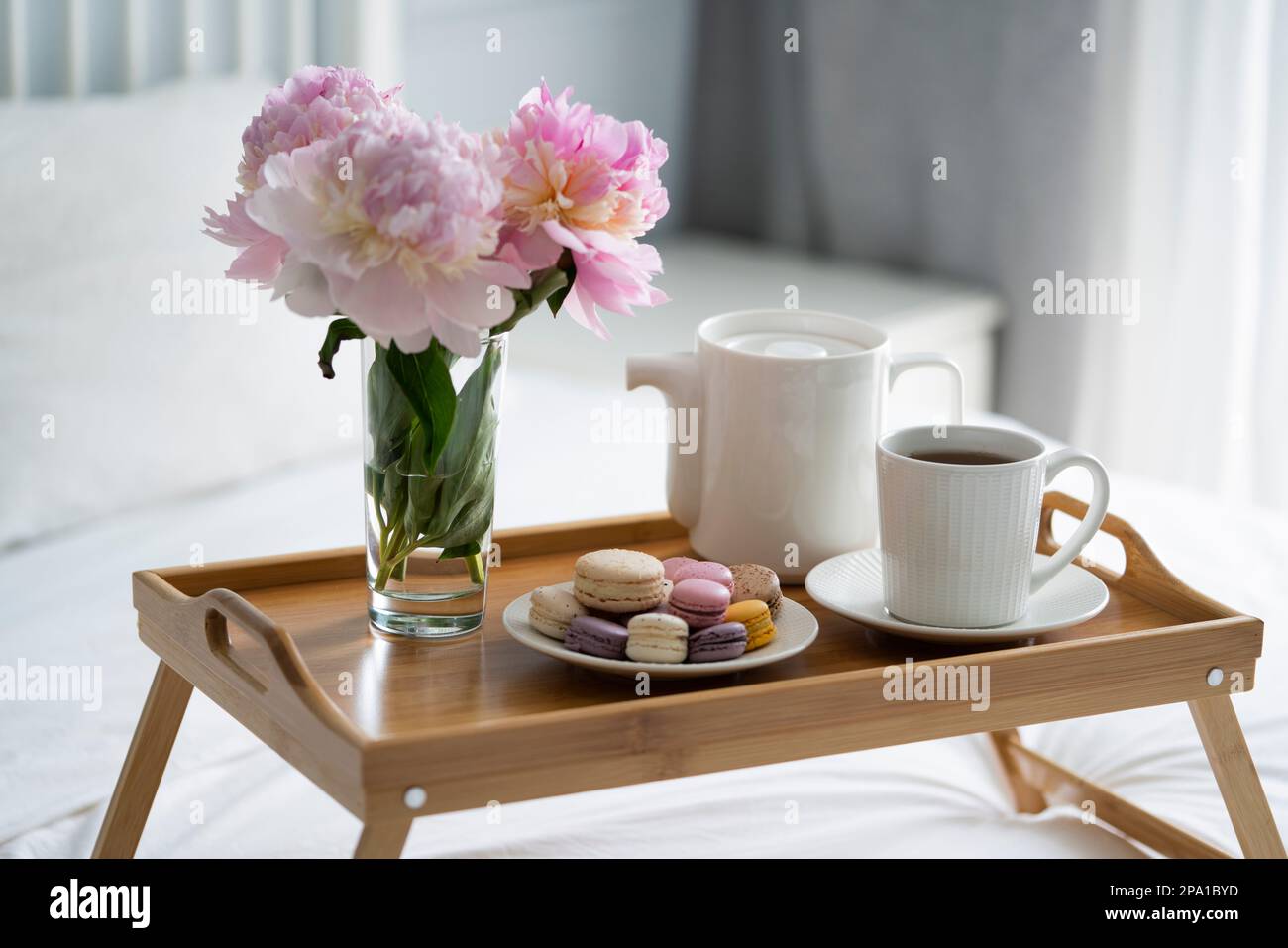 Tray with breakfast on bed Stock Photo - Alamy