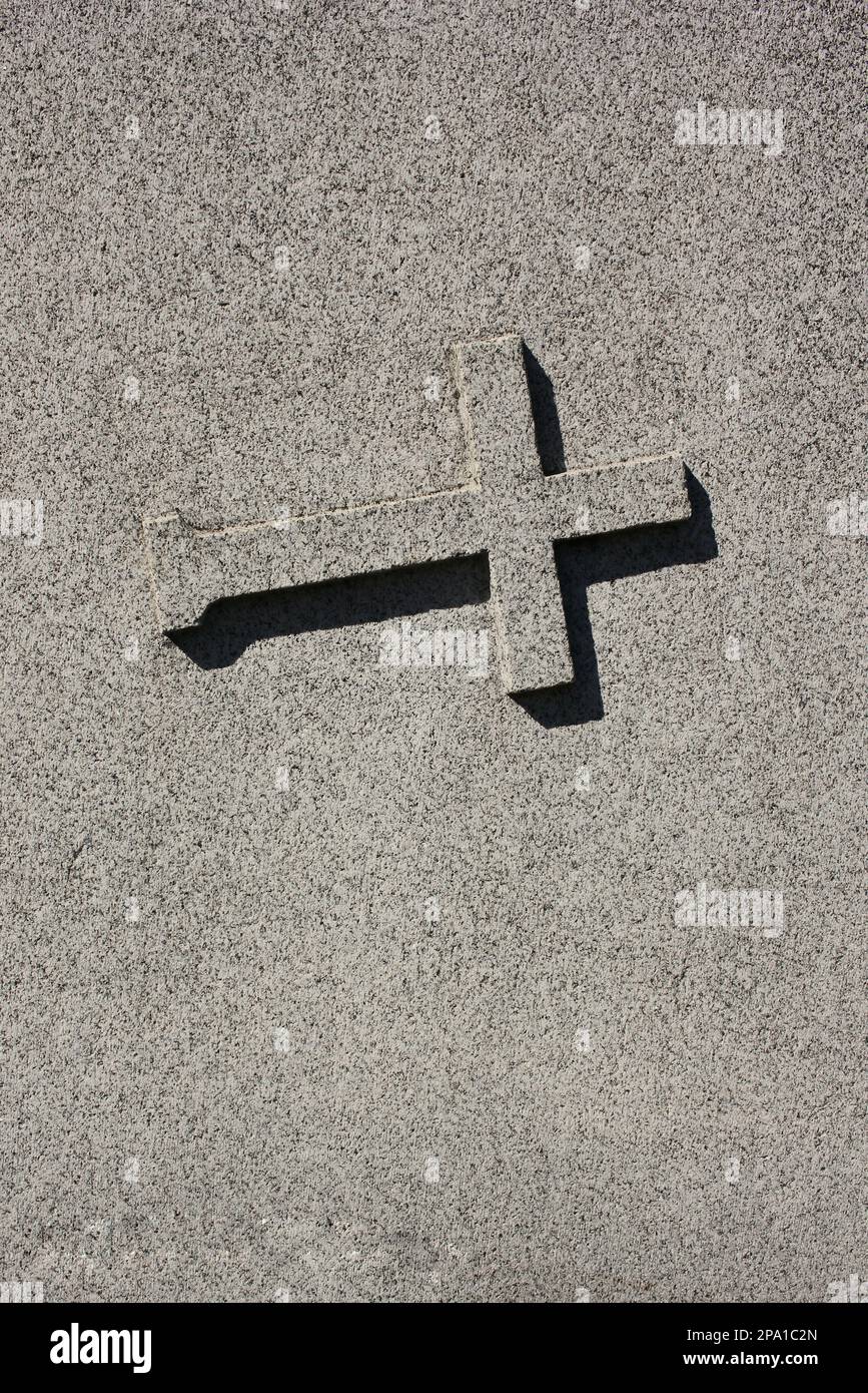 Old stone cross carved into the natural stone wall Stock Photo - Alamy