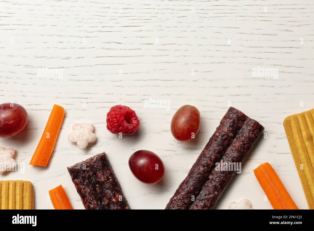 Flat lay composition with different baby finger foods on white wooden ...