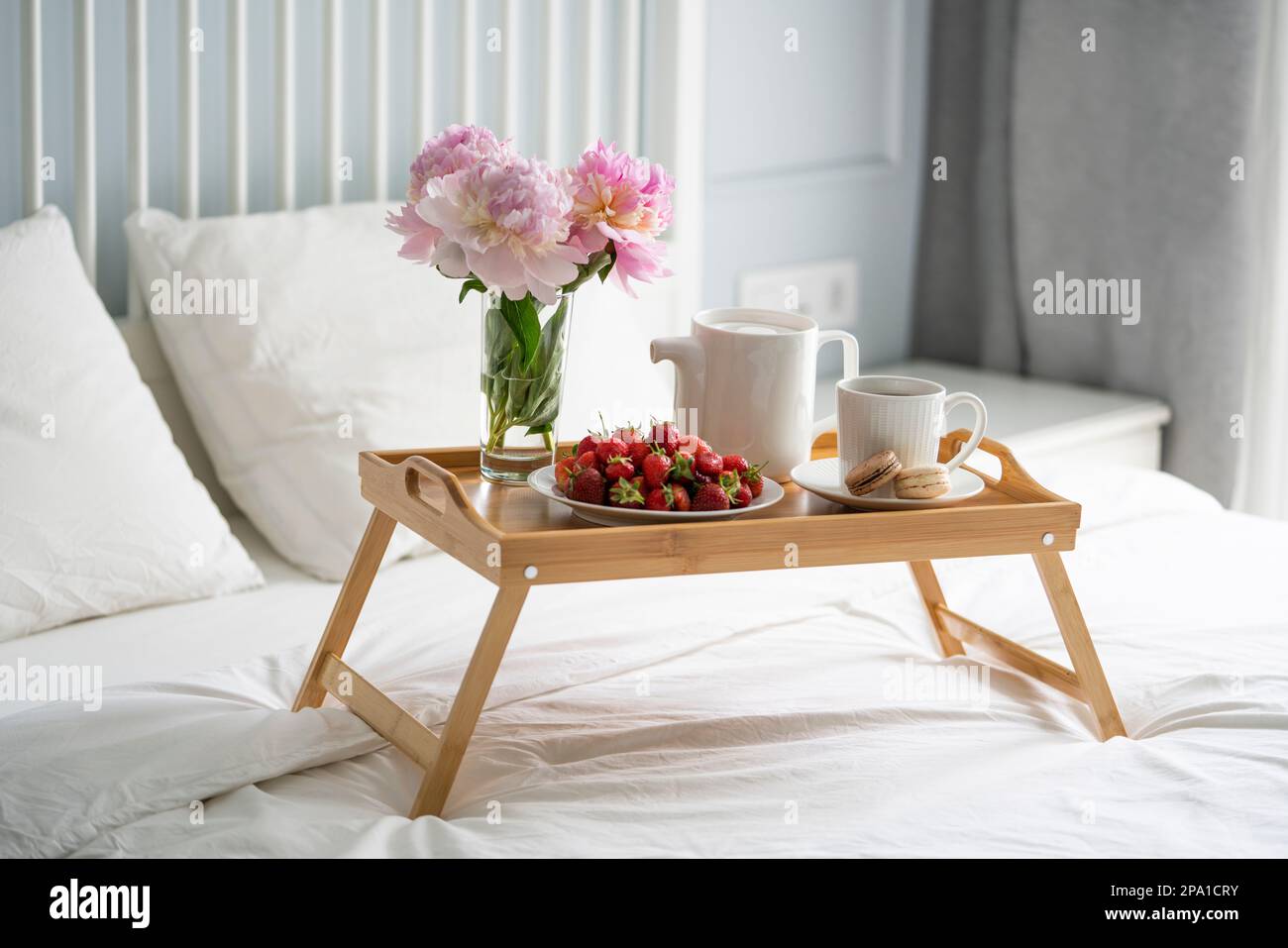 Tray with breakfast on bed Stock Photo - Alamy
