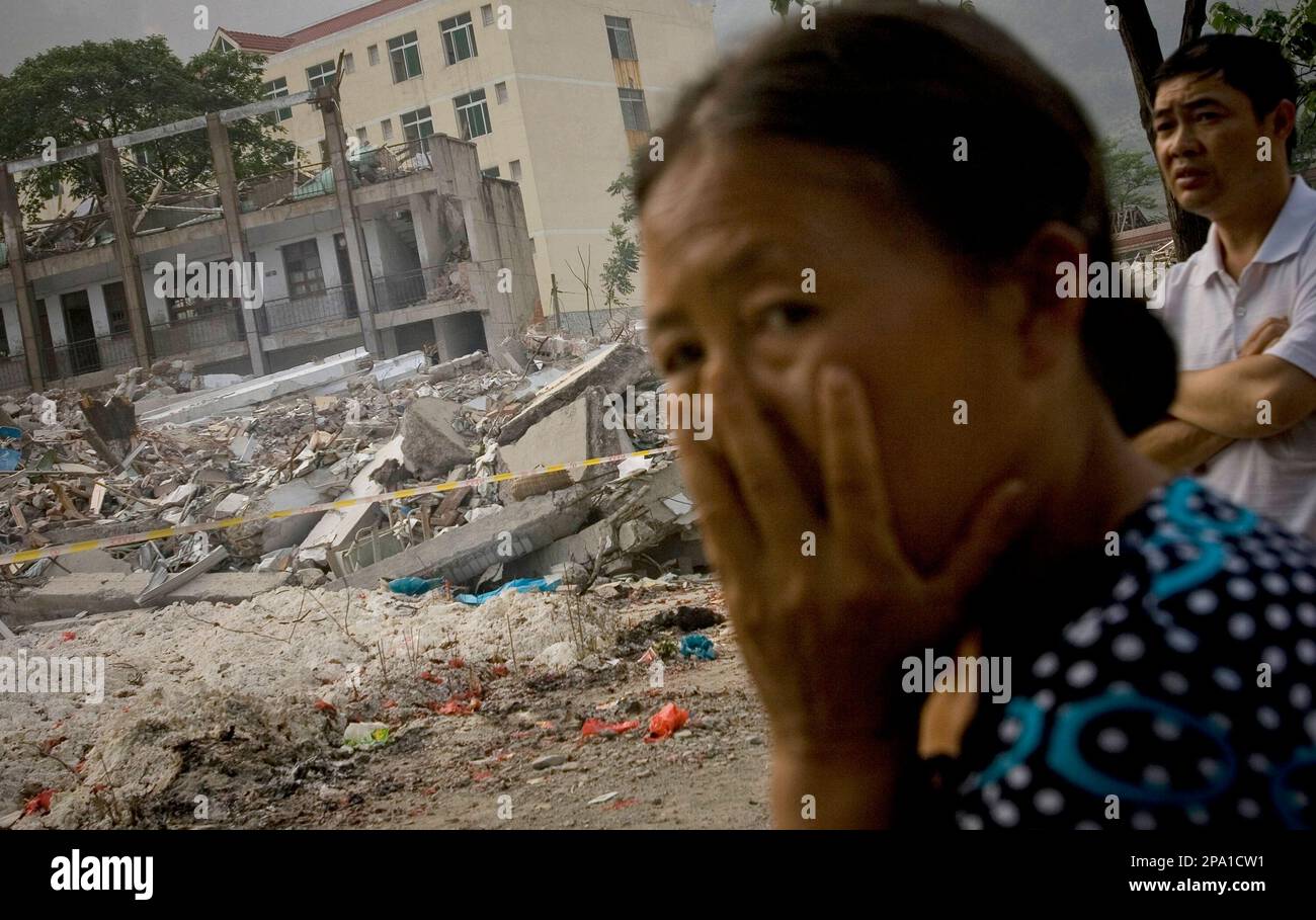 Chinese parents, whose children were killed in the collapsed school ...