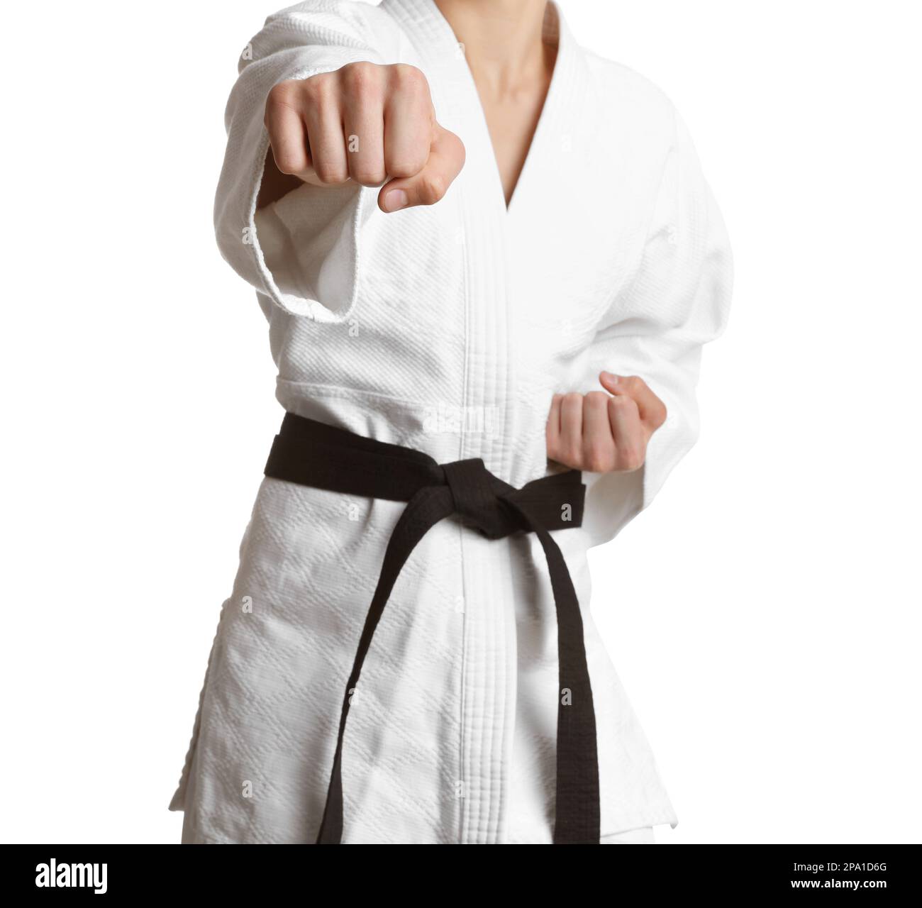 Martial arts master in keikogi with black belt against white background ...
