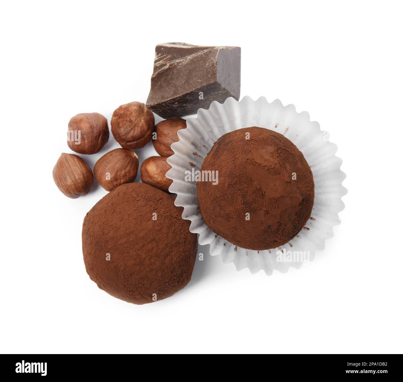Delicious chocolate truffles with ingredients on white background, top ...