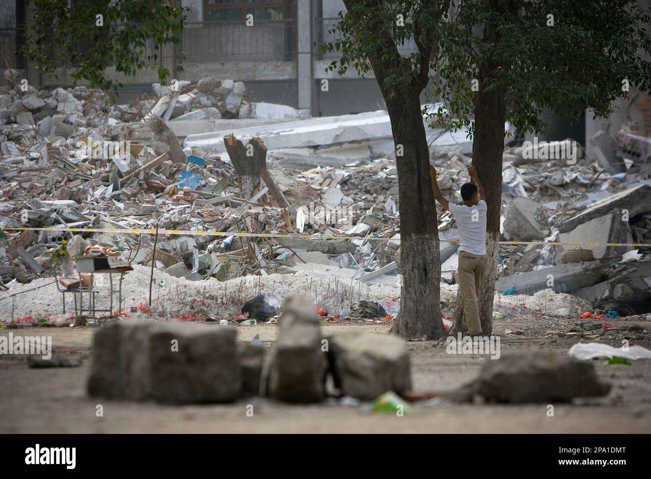 A Beichuan resident mourns for his son killed in a collapsed school ...