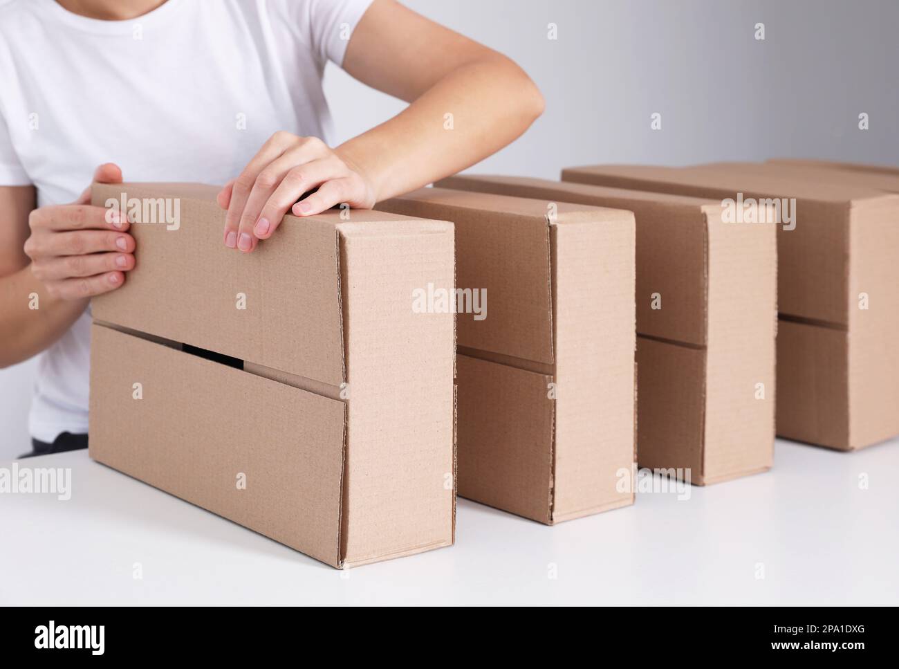 Closeup cardboard packaging manufacturing process hi-res stock ...