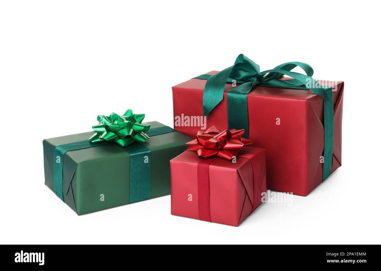 Red and green gift boxes with bows on white background Stock Photo - Alamy