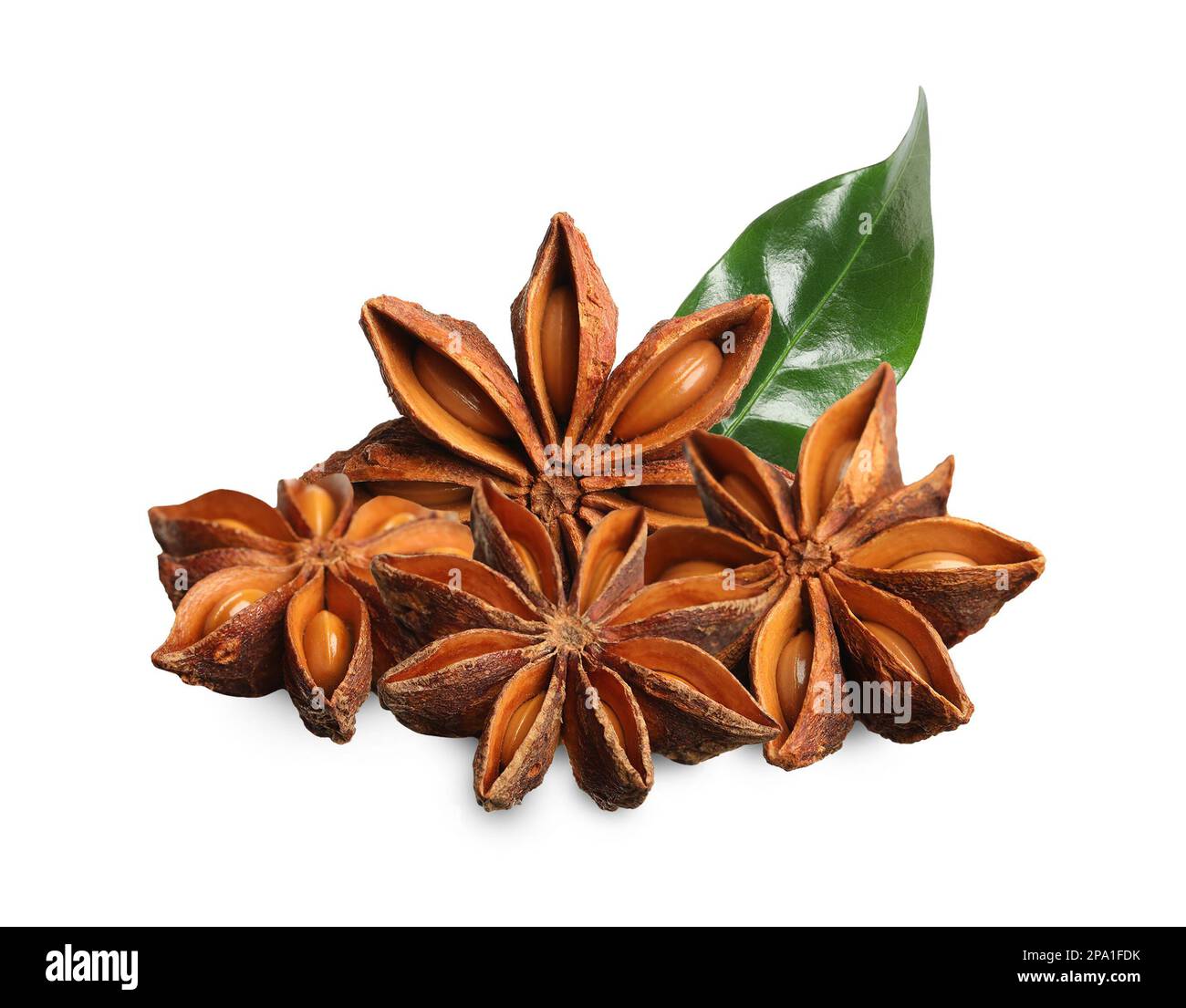 Aromatic dry anise stars and green leaves on white background Stock ...