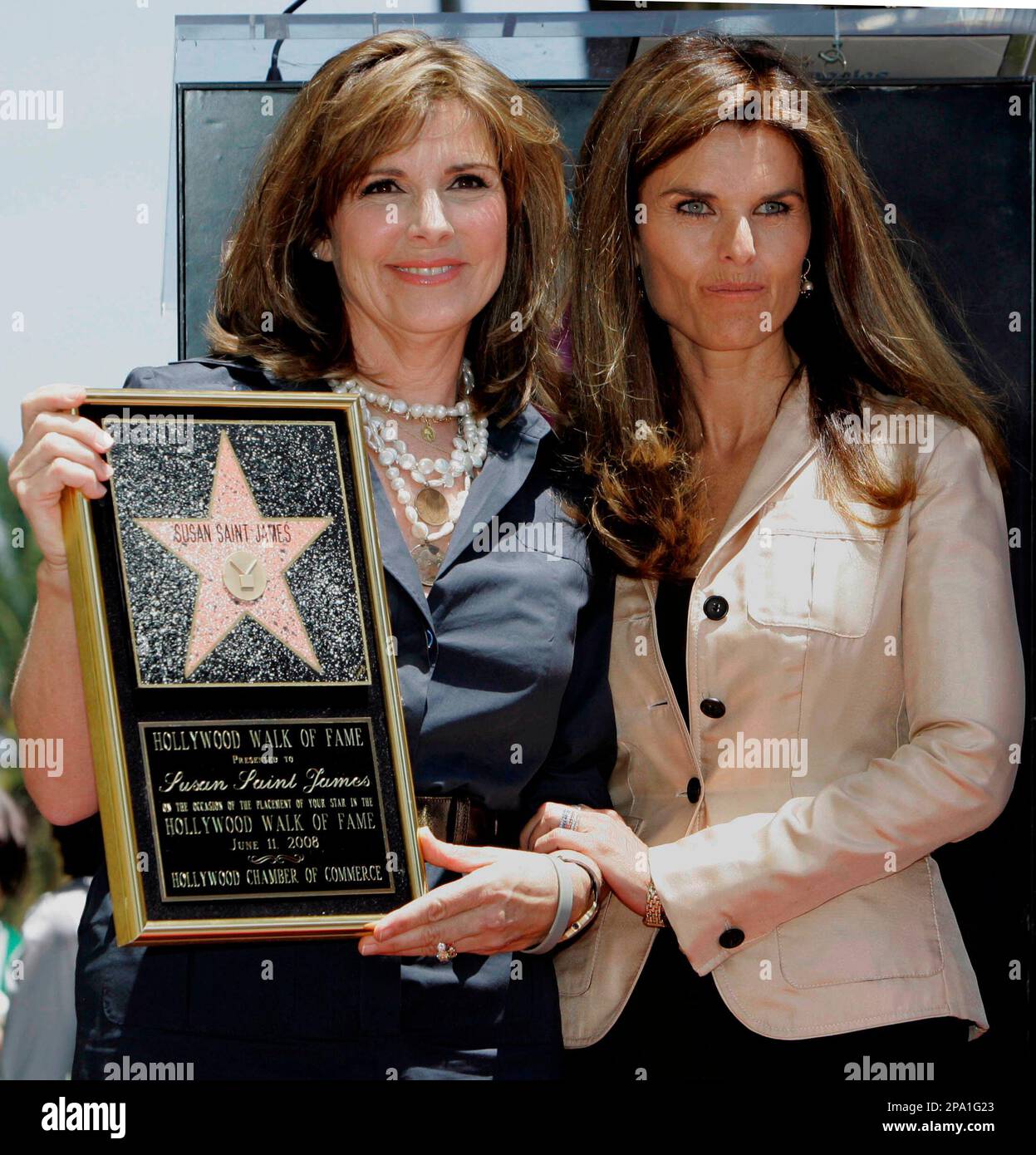 Actress Susan Saint James, left, and Maria Shriver pose during a ...