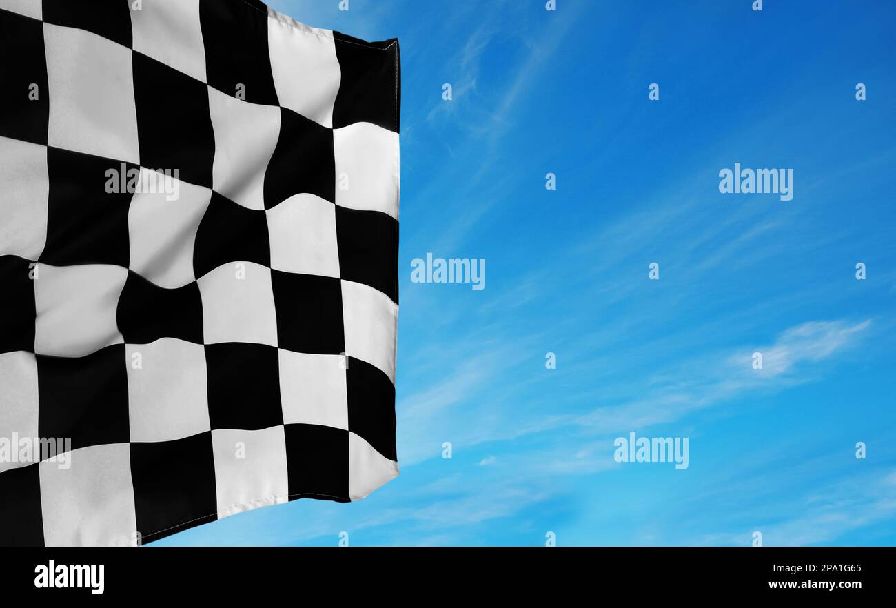 Checkered racing finish flag against blue sky. Space for text Stock ...