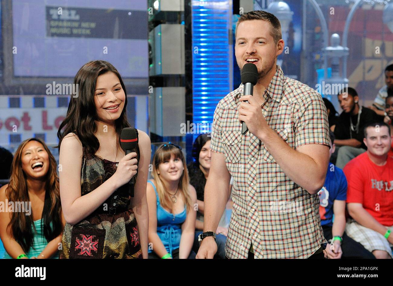 Actress and singer Miranda Cosgrove, left, talks with VJ Damien Fahey ...