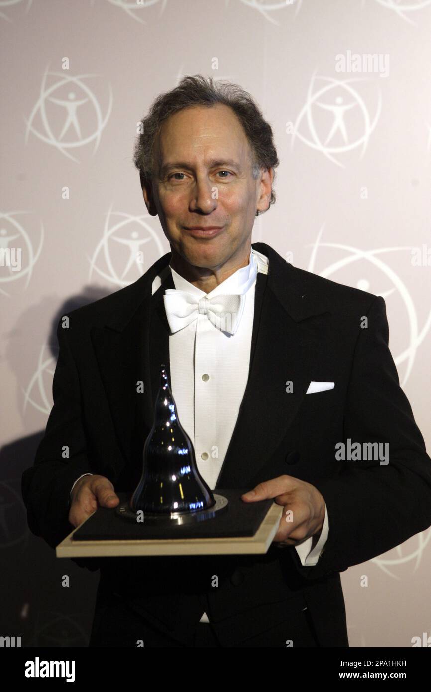 U.S. Professor Robert Langer from Harvard-MIT holds his trophy after ...
