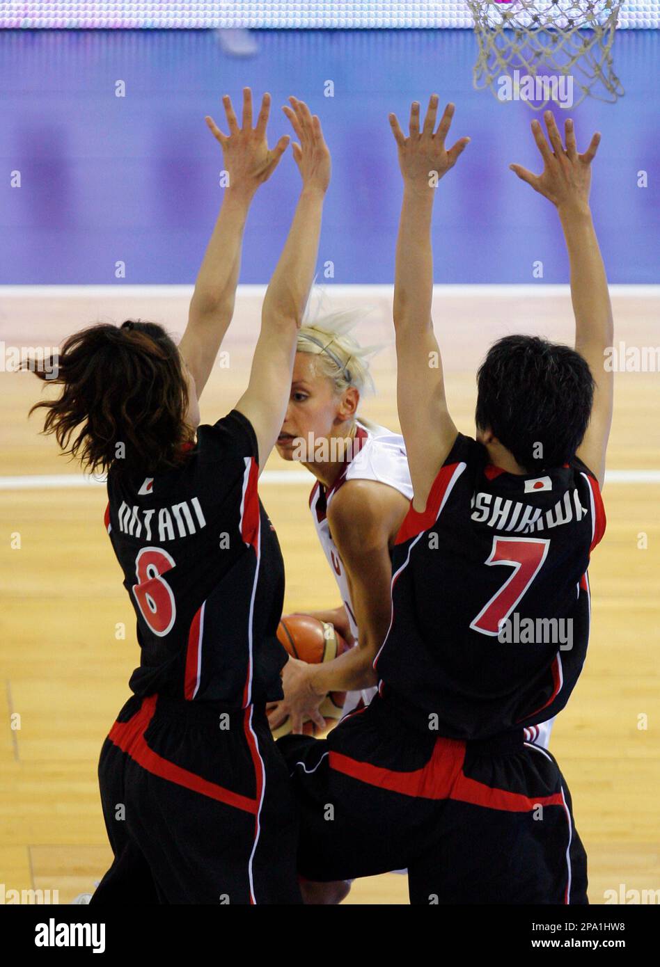 Latvia's basketball player Gunta Basko, center, drives to the basket ...