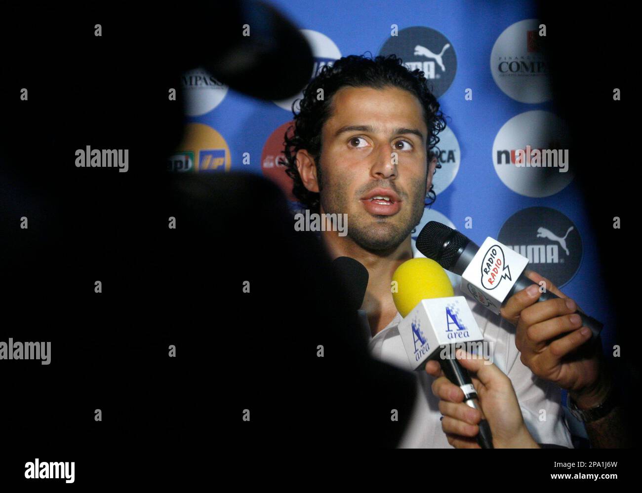 Defender Fabio Grosso listens to reporters' questions during a press ...
