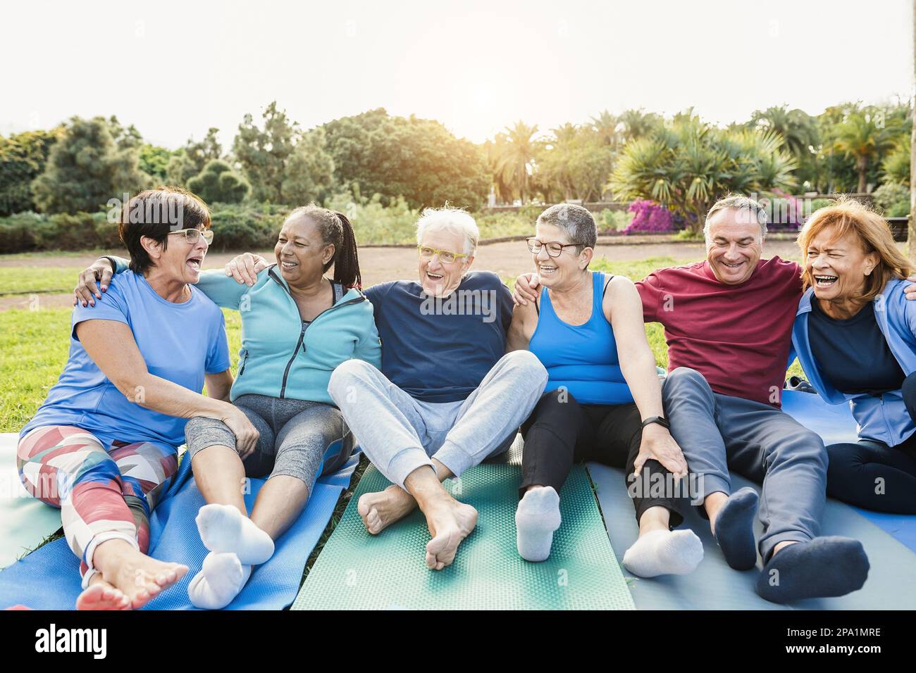 Multiracial senior people having fun after workout exercises outdoor ...