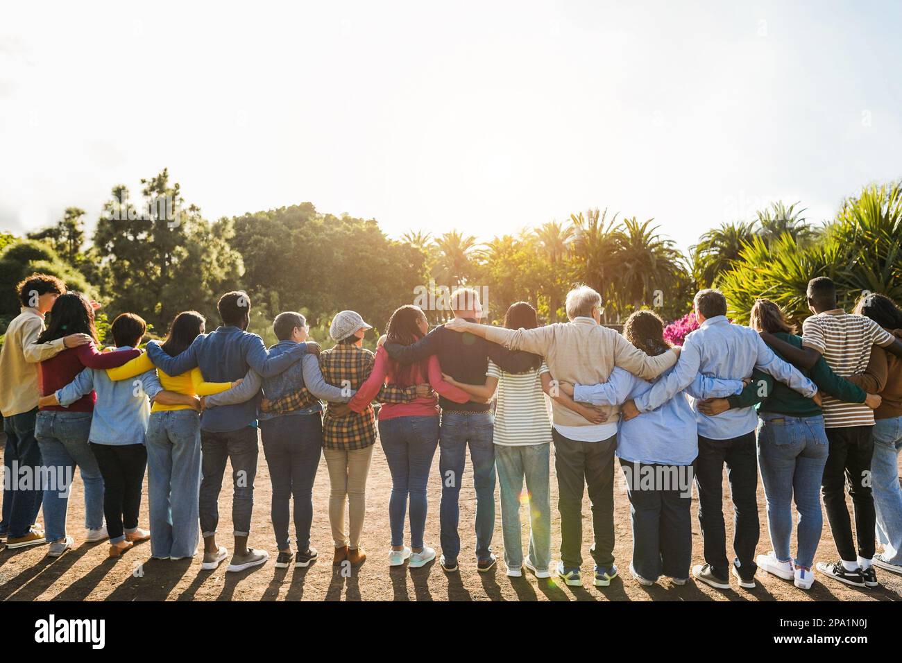 Group of multigenerational people hugging each others - Support ...