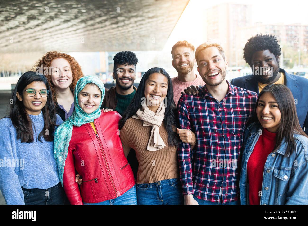 Young diverse people having fun outdoor laughing together - Focus on arabian girl face Stock ...
