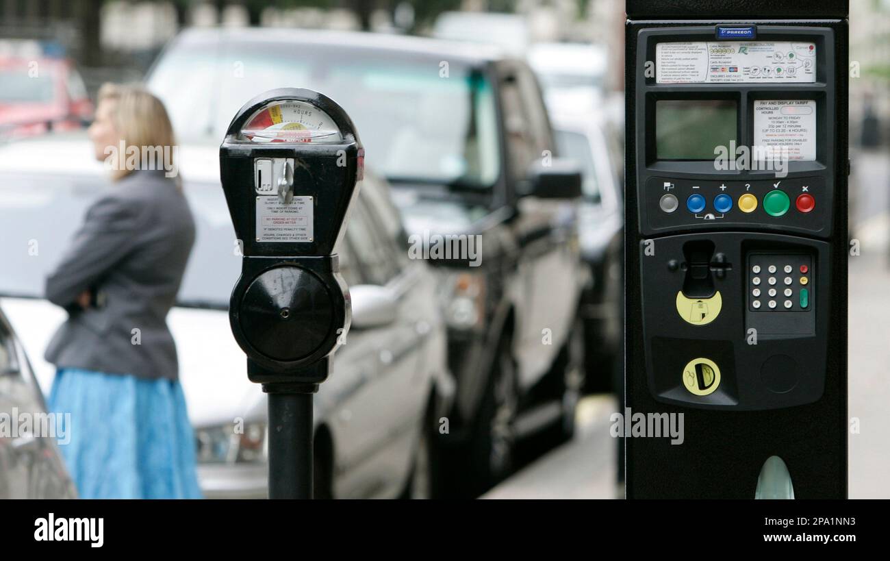 A manual parking meter originally from the early 1970's stands on ...