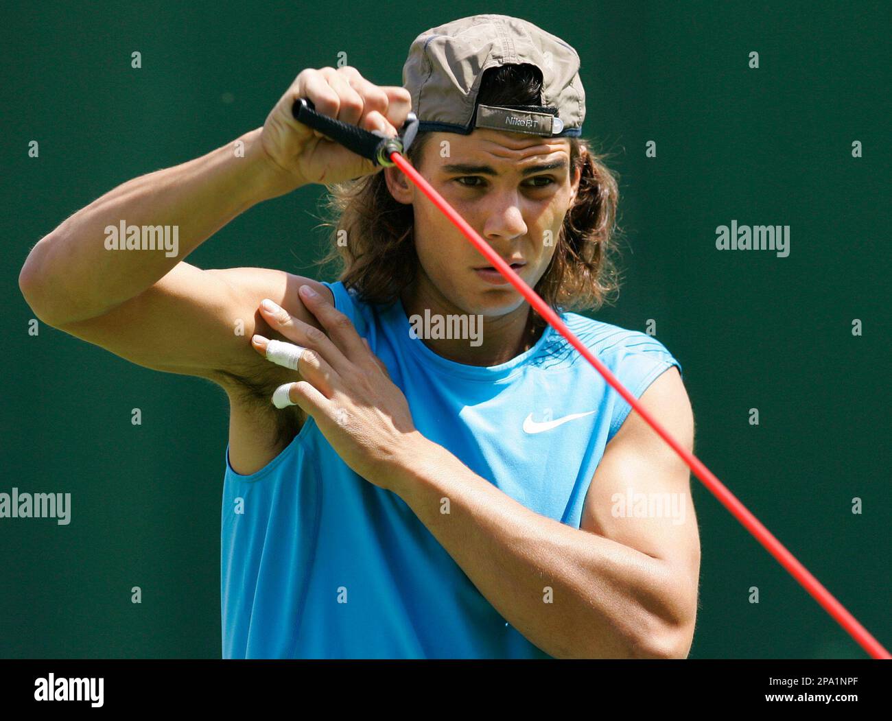 Spain's Rafael Nadal stretches during a training session at the Artois ...