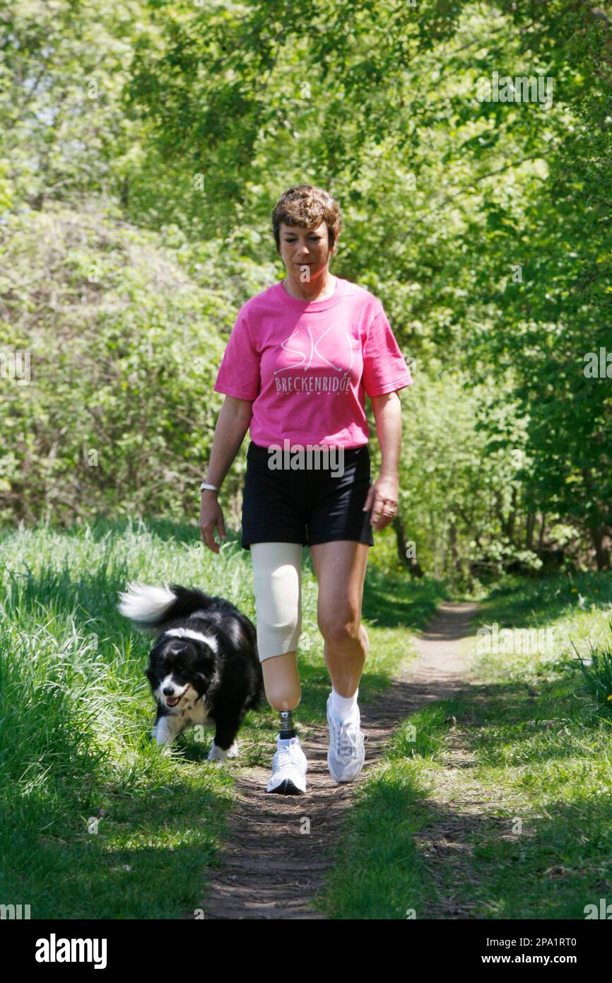 Eileen Casey walks with her dog in Burlington, Vt., Wednesday, May 14 ...