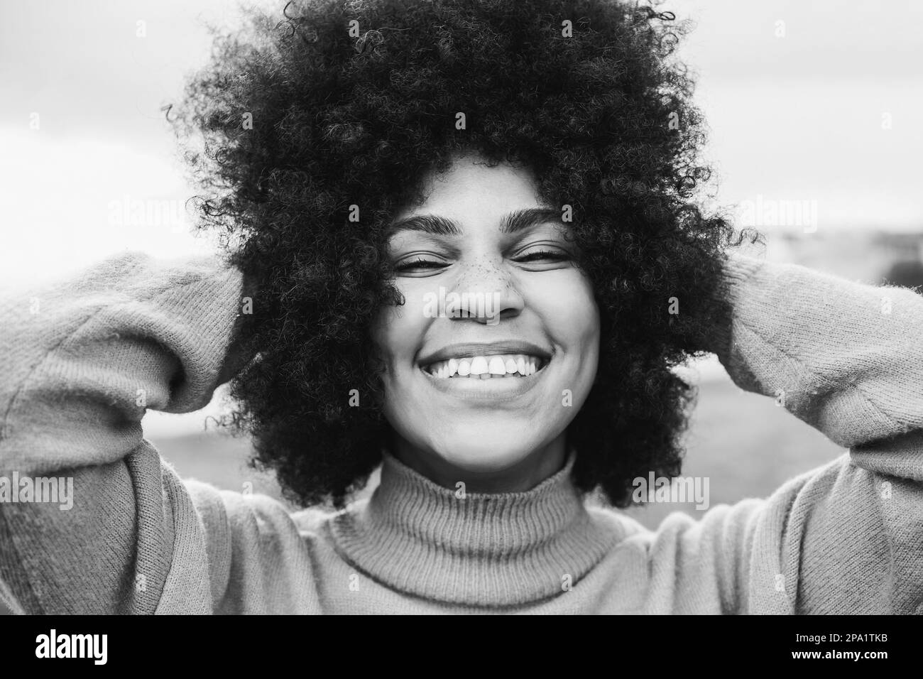 Young african girl smiling on camera outdoor - Main focus on nose ...