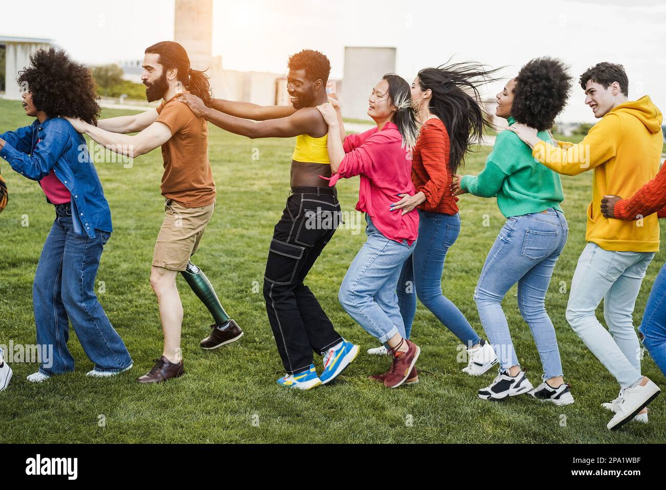 Young diverse people having fun outdoor dancing together - Focus on ...