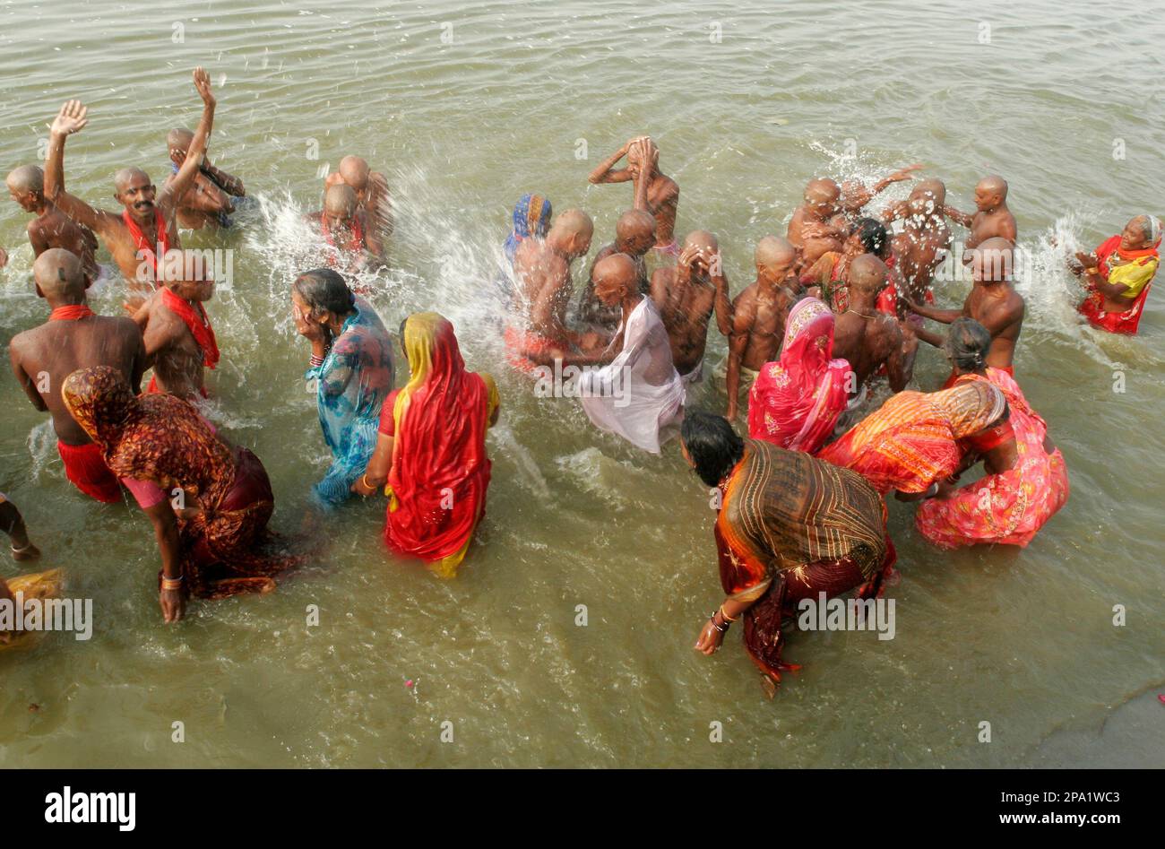 Hindu devotees from Bihar state take a holy dip in River Ganges in ...
