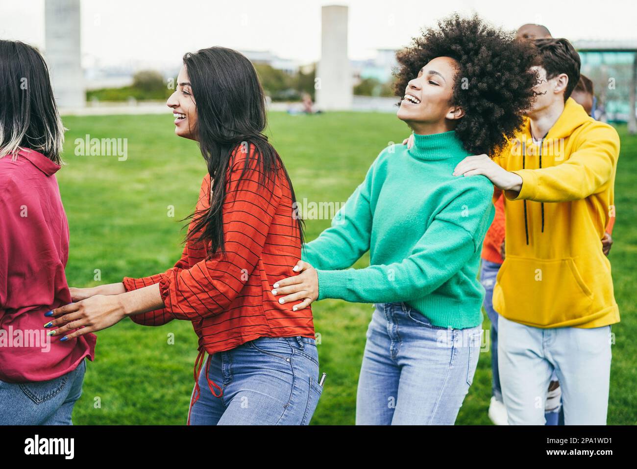 Young diverse people having fun outdoor dancing together - Focus on ...