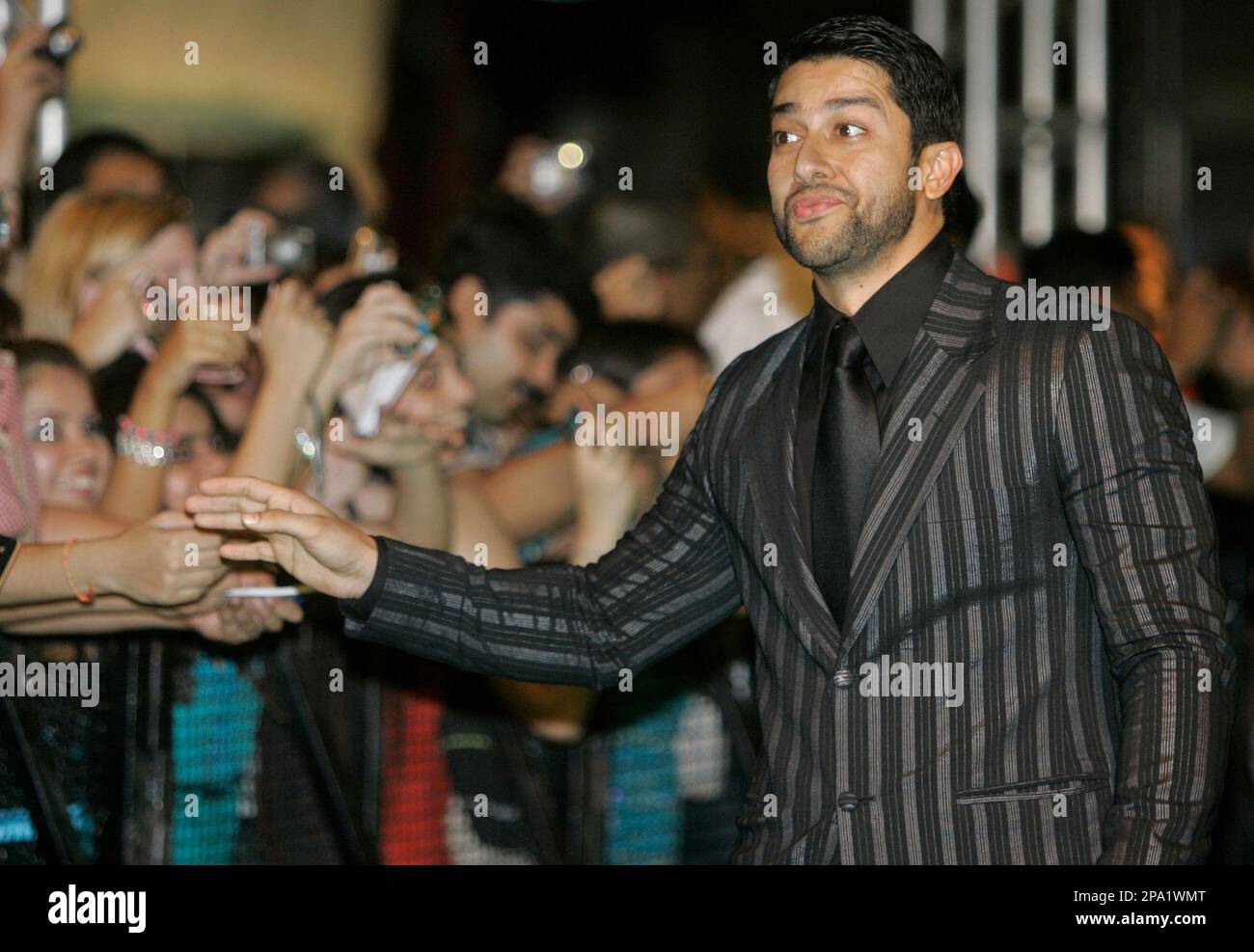Bollywood actor Aftab Shivdasani talks to fans as he arrives at the 9th ...