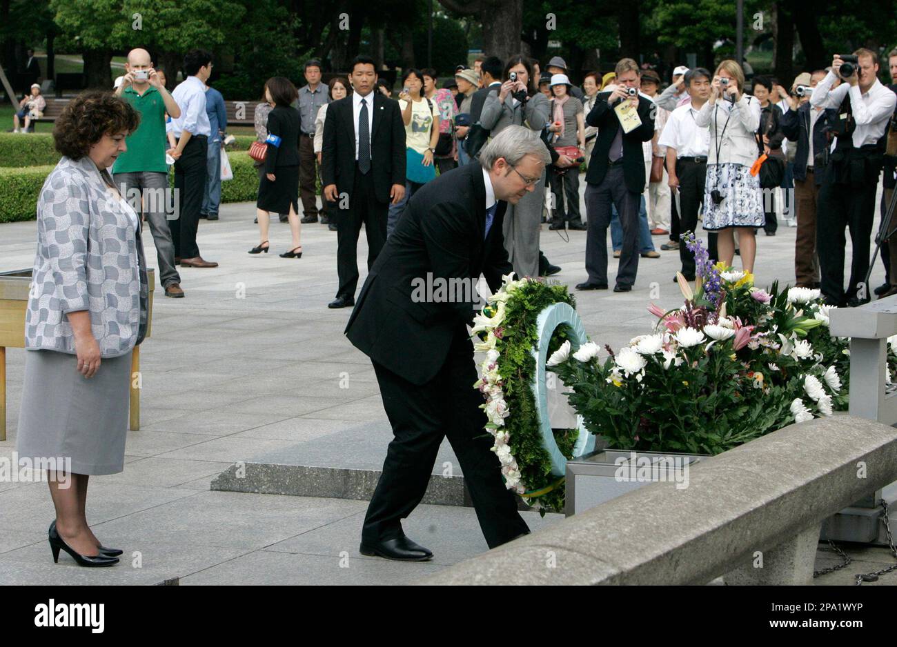 Australian Prime Minister Kevin Rudd places a wreath before the ...