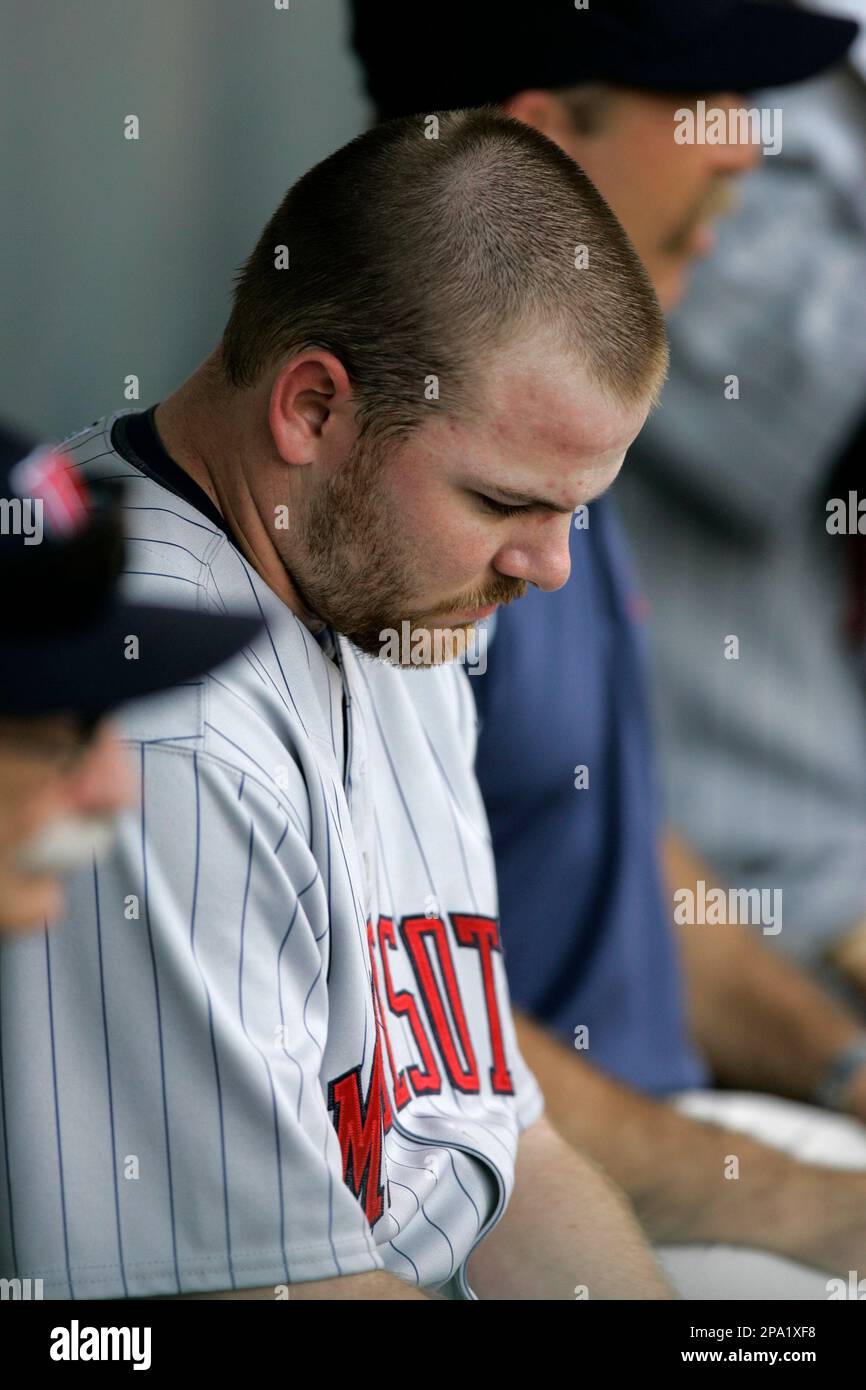 Minnesota Twins' Jason Kubel sits in the dugout during the eighth ...