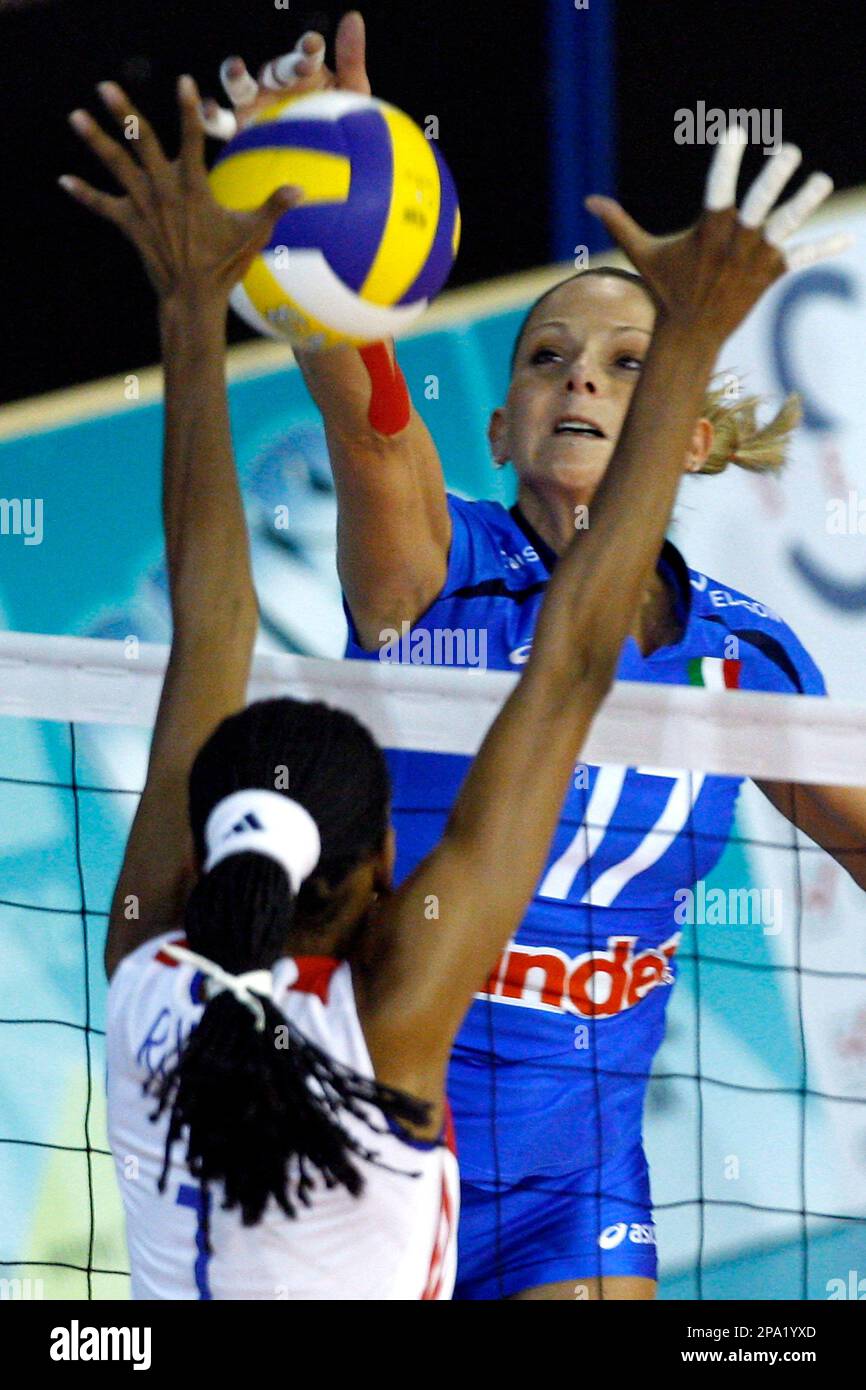 Italy's volleyball player Simona Gioli, wearing blue, in action against ...