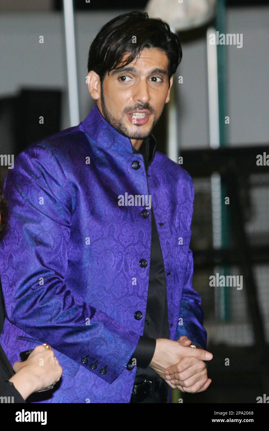 Indian actor Zhaheed Khan talks to media as he arrives on the green ...