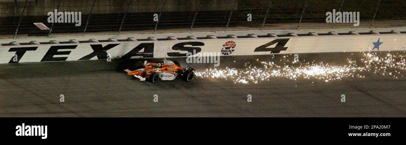 Driver Enrique Bernoldi, of Brazil, slides down the track after hitting ...