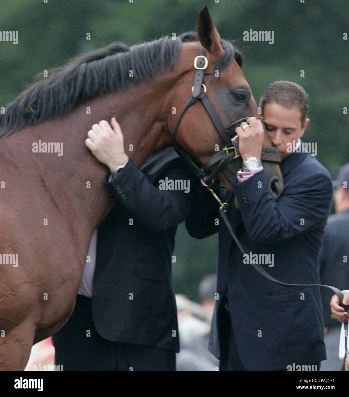 Bloodstock agent Frank Lyons, left and owner Michael Iavarone hug Big ...