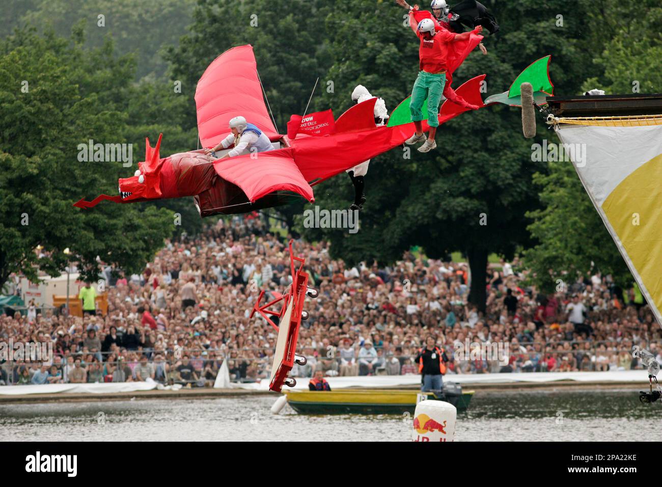 Flying team 'Dragons Tale' flies off a ramp on Serpentine Lake in Hyde ...