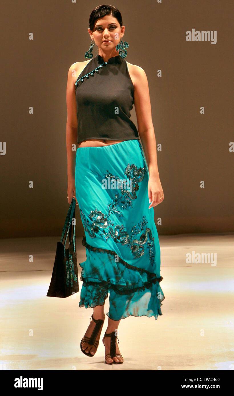 A Pakistani model displays a creation of local designer Samar Mehdi ...