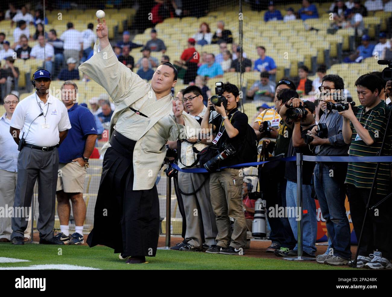Mongolian sumo wrestler Hakuho shows off his throwing arm before a ...