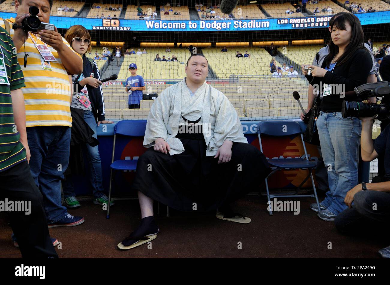 Mongolian sumo wrestler Hakuho watches batting practice before a Major ...