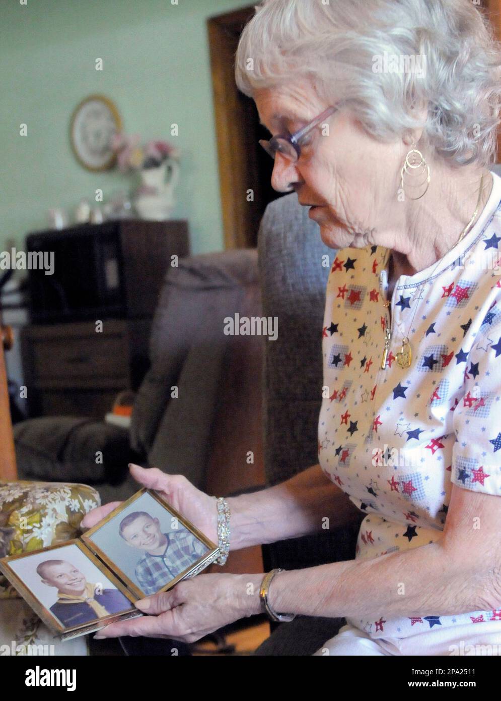 **ADVANCE FOR SUNDAY, JUNE 8** Mary Scott holds photos of her son Mark ...