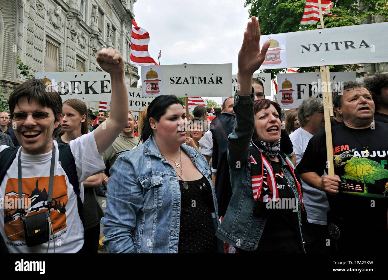 Hungarian supporters of far-right groups hold banners of historical ...