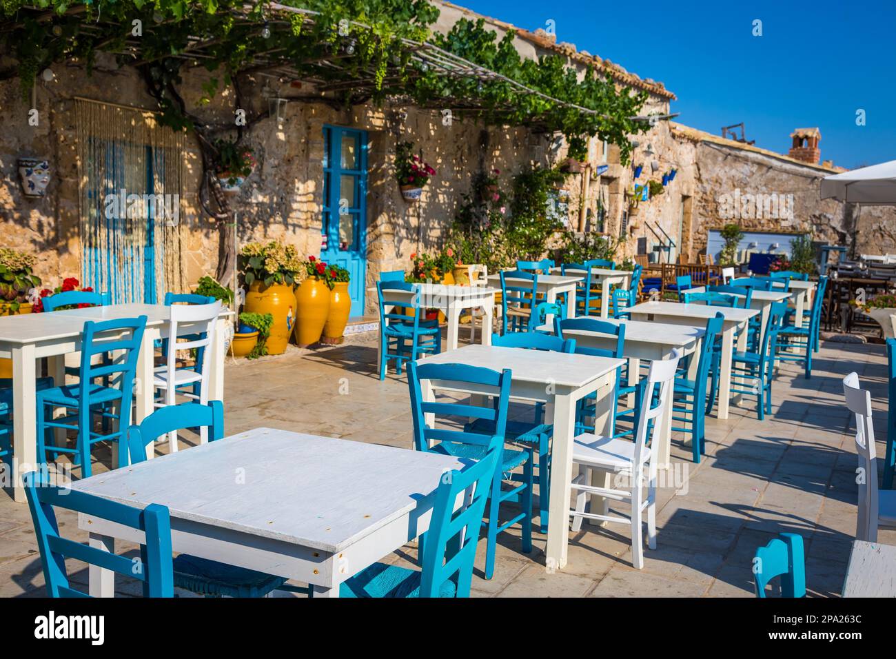 Tables and chairs setup in a traditional Italian restaurant in ...