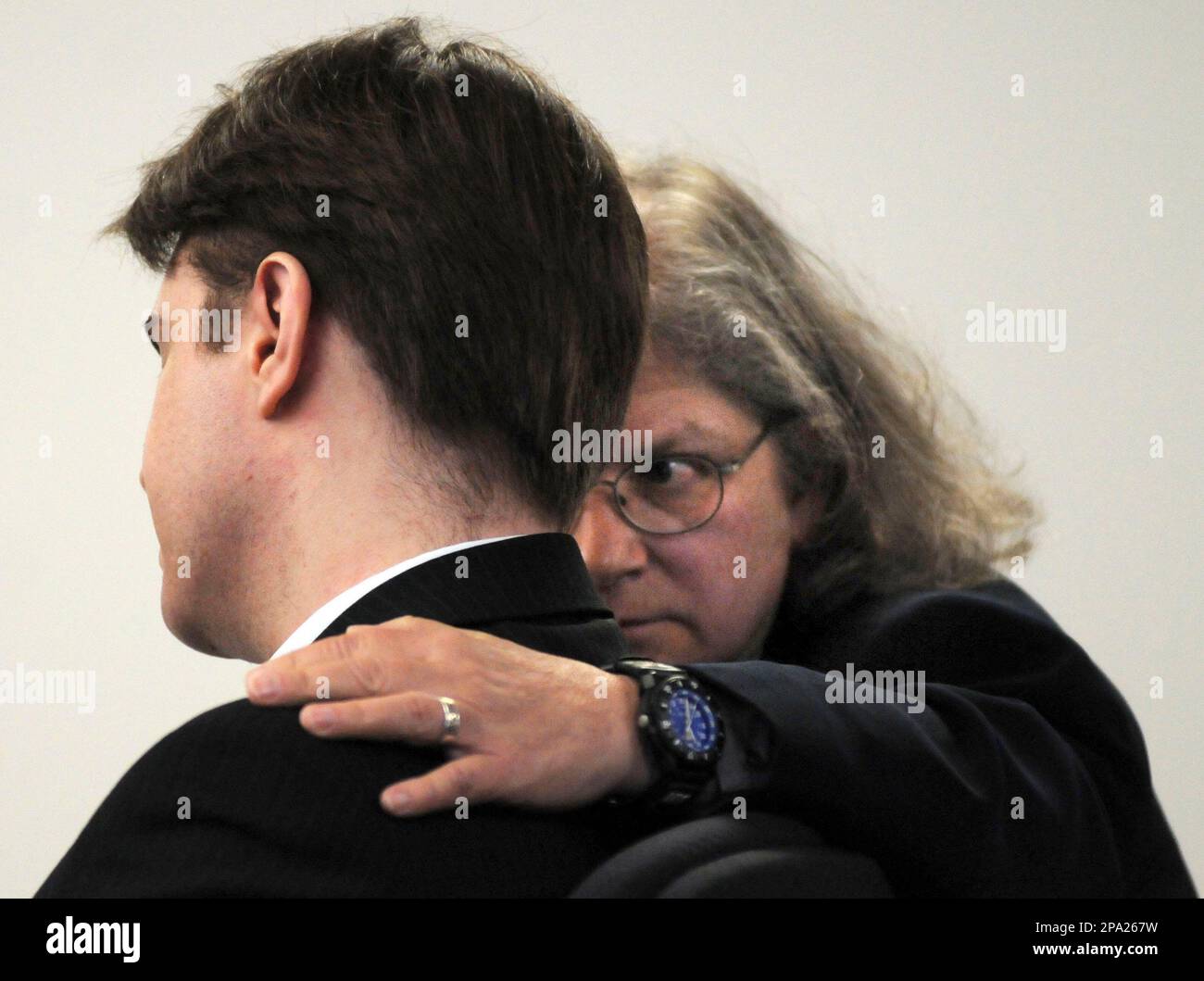 Defense lawyer Stephanie Page, right, speaks to Neil Entwistle and ...