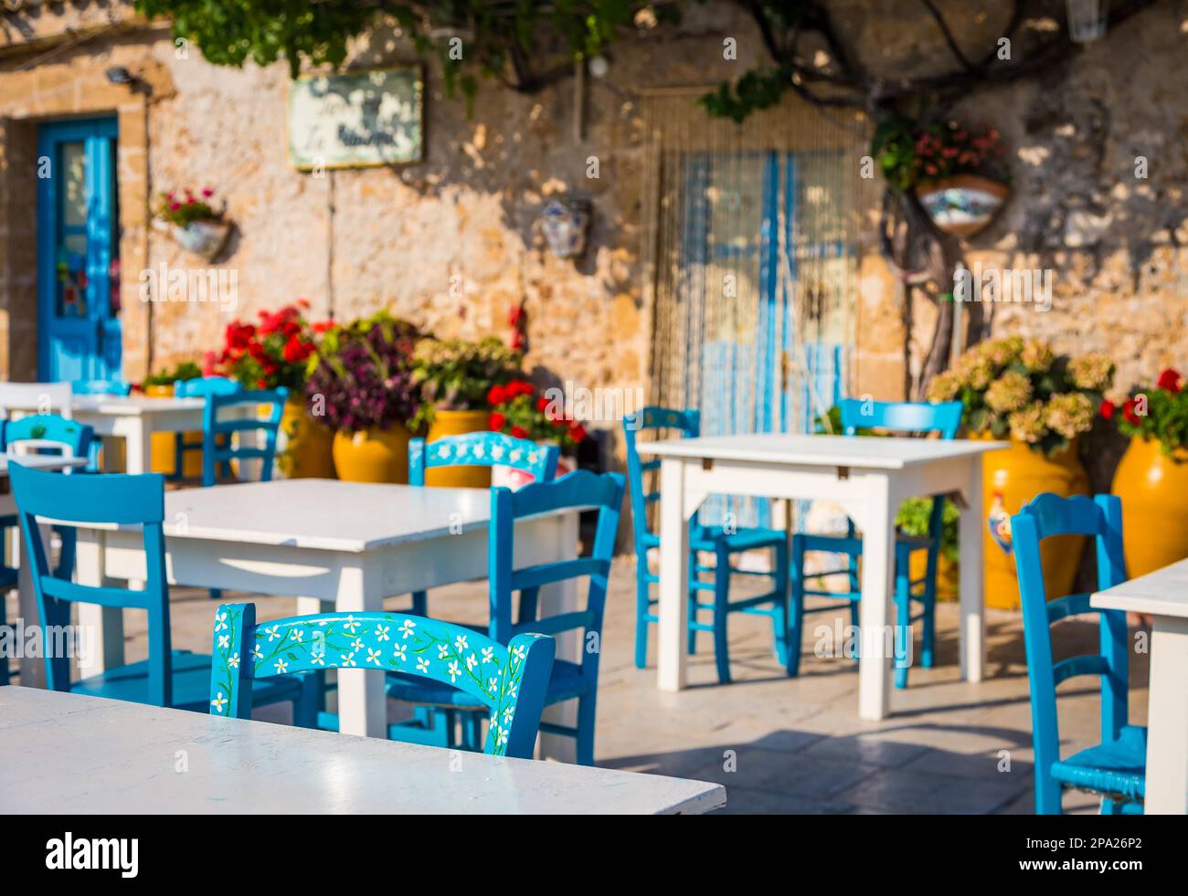 Tables and chairs setup in a traditional Italian restaurant in ...