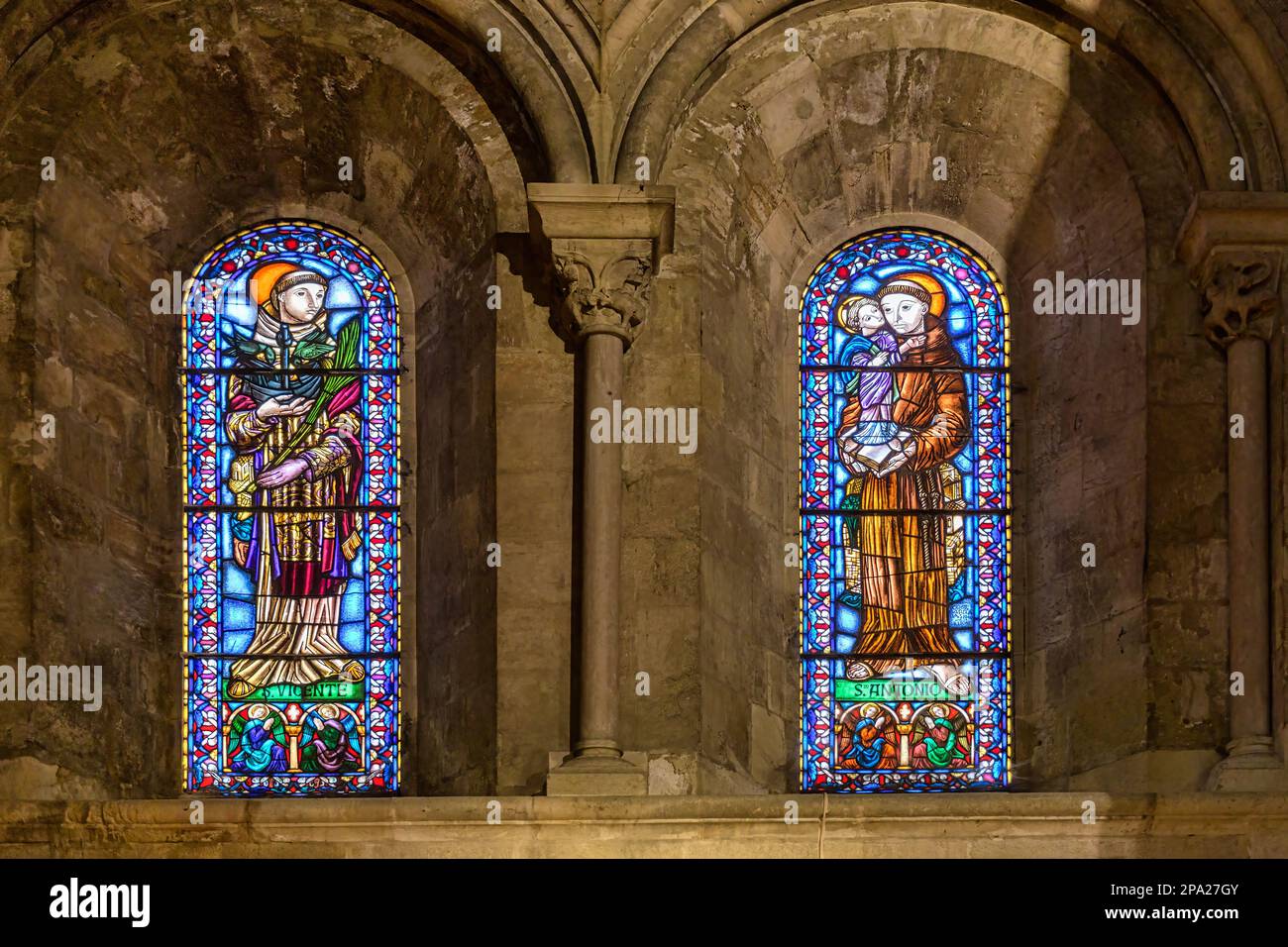 Two stained-glass windows with images of religious saints. The skylight ...