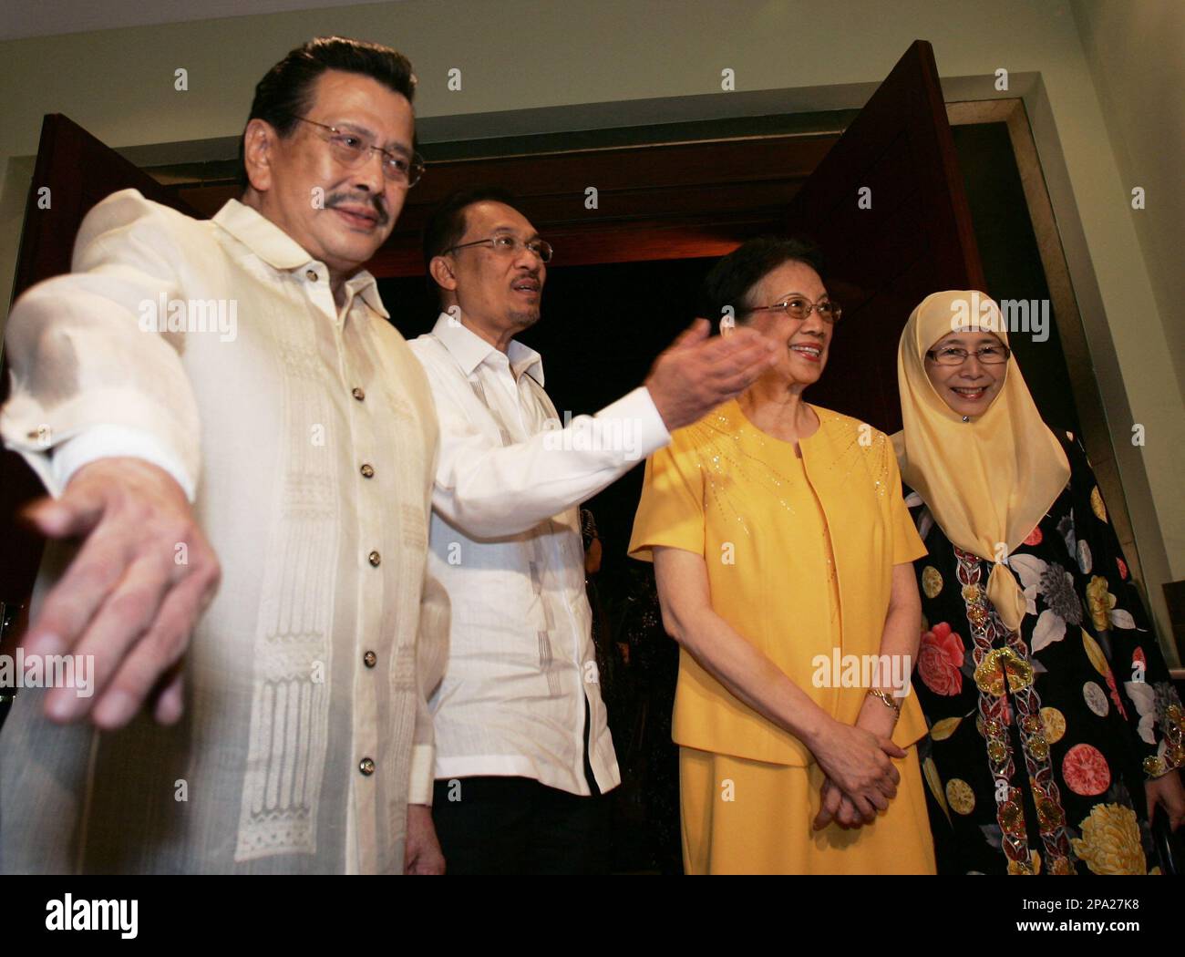 Former Philippine President Joseph Estrada, left, gestures as he ...